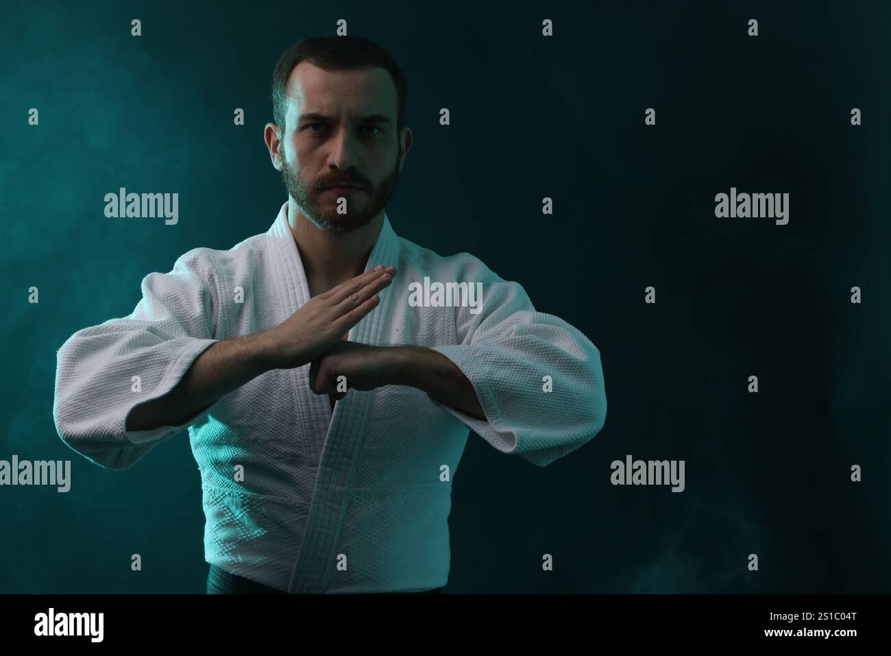 Karate fighter wearing uniform in color lights and smoke Stock Photo ...