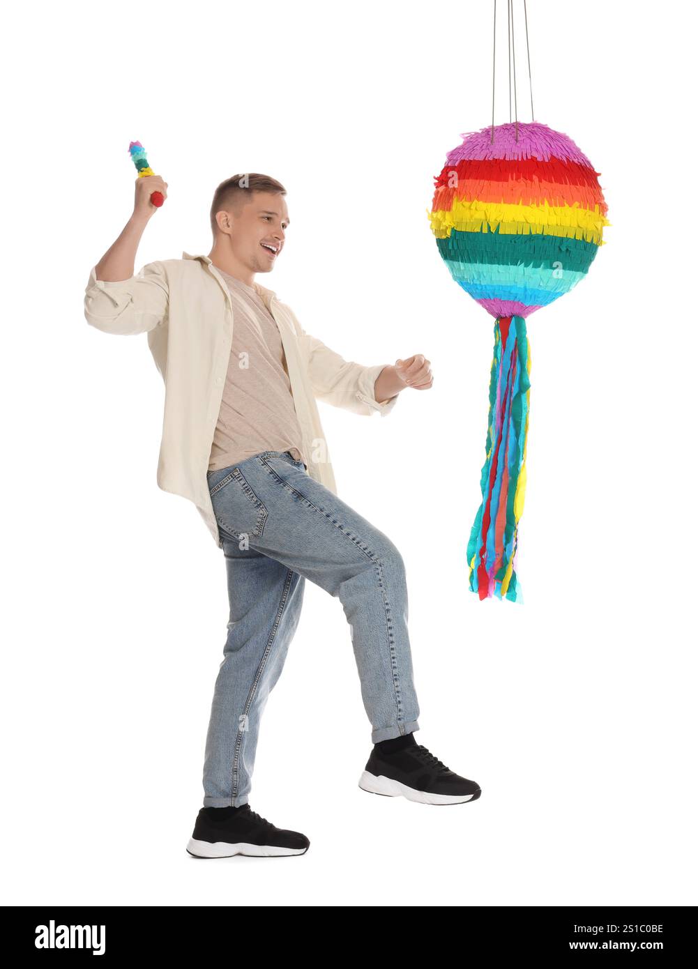 Happy man breaking pinata on white background Stock Photo - Alamy