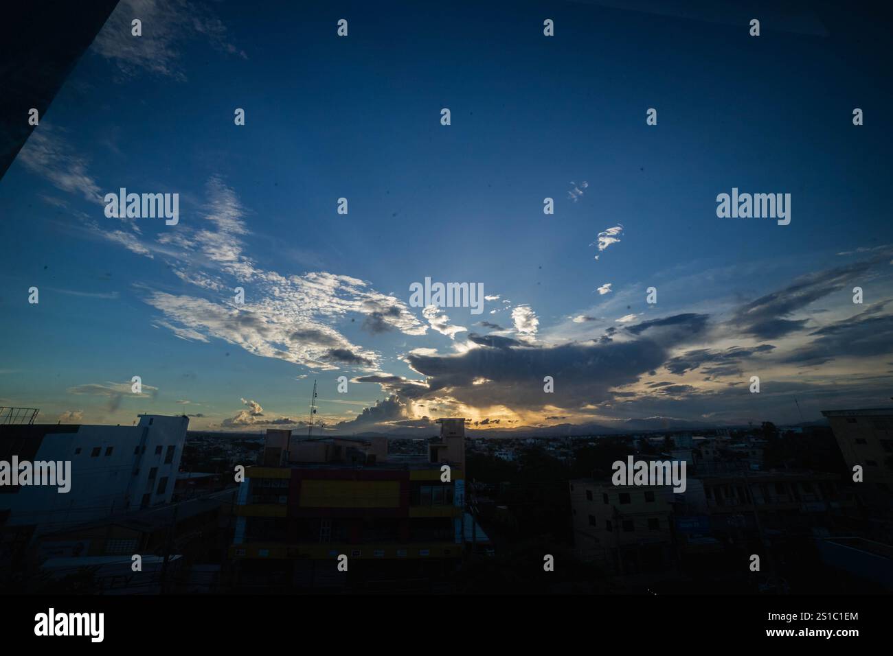 wide view, beautiful sunset with clouds and blue sky. santo domingo ...