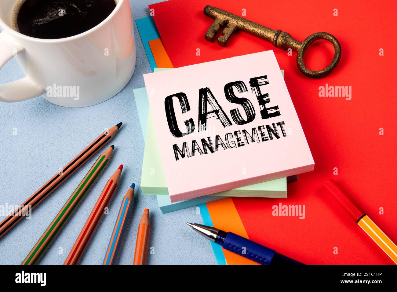 Case Management. Notepad with text, coffee mug and golden key on office ...