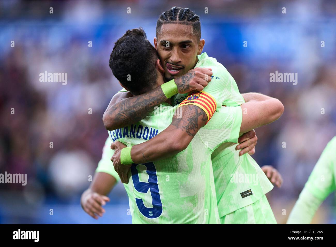Robert Lewandowski of FC Barcelona celebrates with his teammate Raphael ...