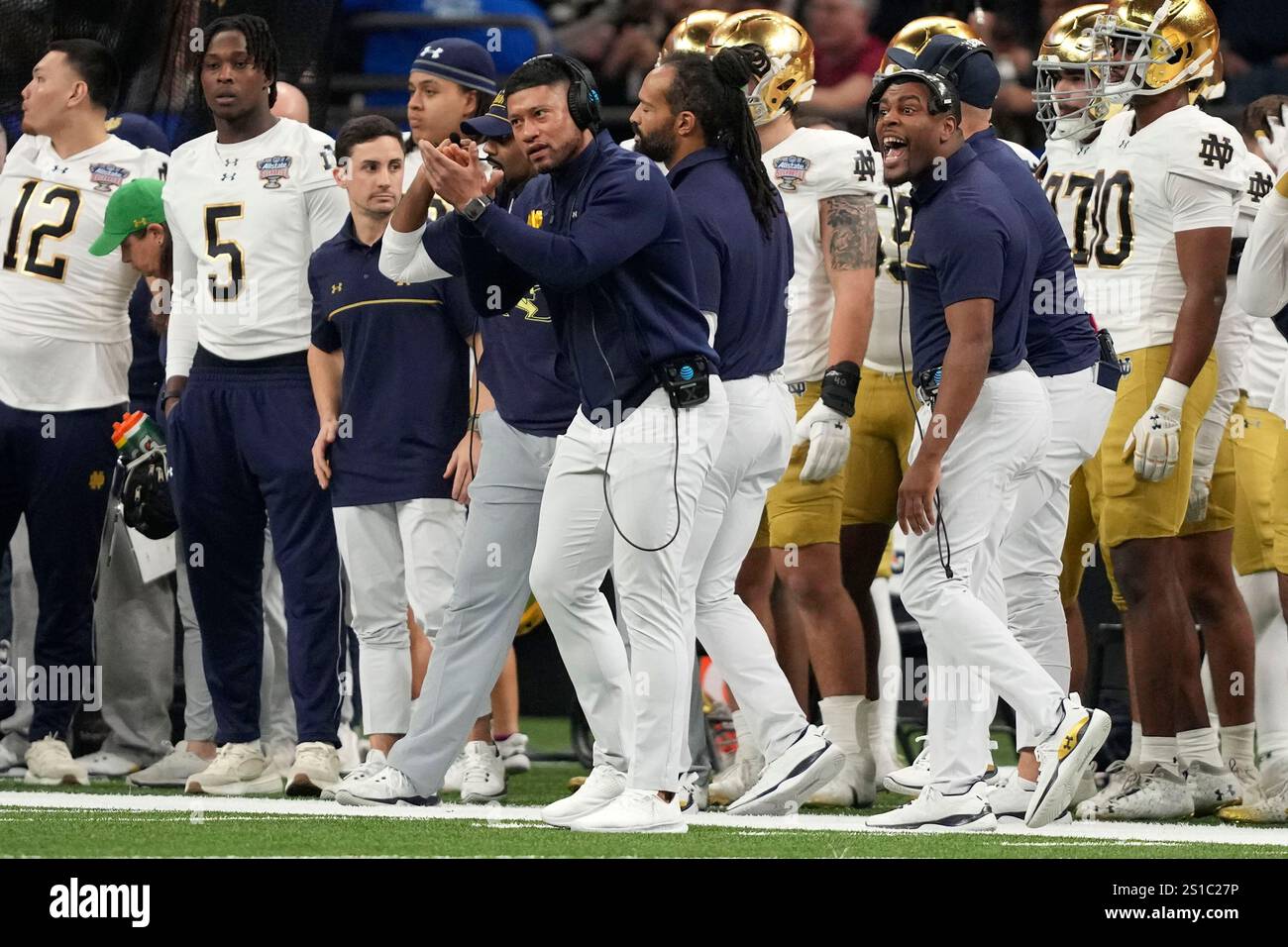 Notre Dame head coach Marcus Freeman, center, watches from the sideline ...