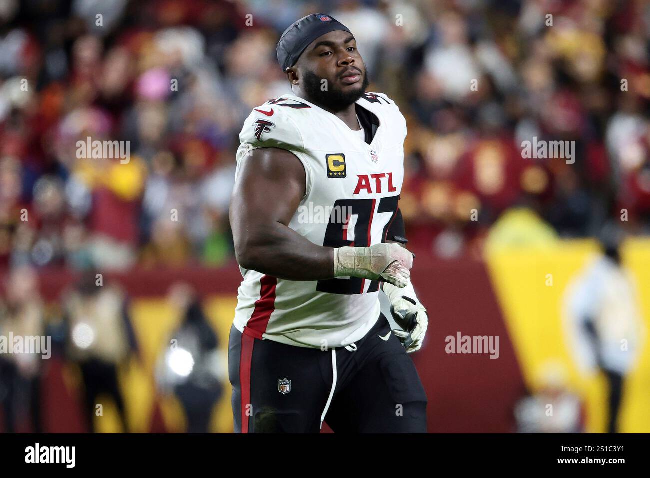 Atlanta Falcons defensive end Grady Jarrett (97) runs off the field ...