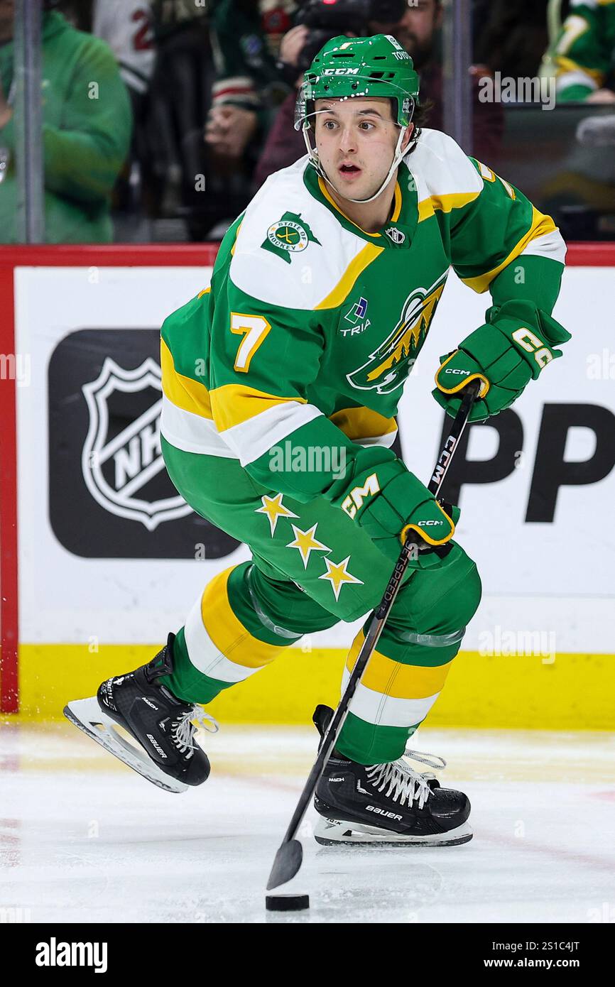 Minnesota Wild defenseman Brock Faber (7) skates with the puck during ...
