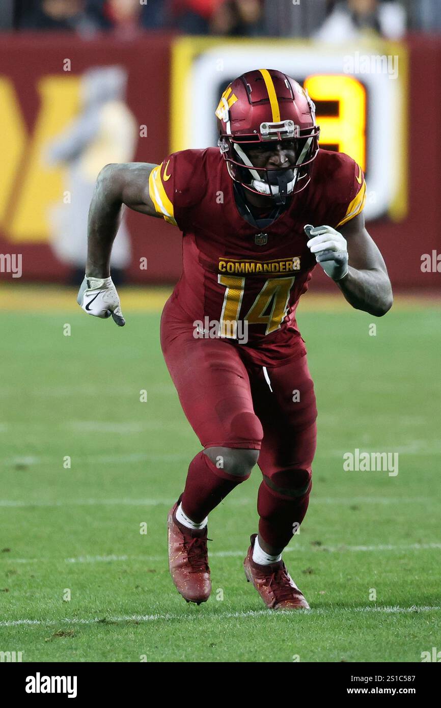 Washington Commanders wide receiver Olamide Zaccheaus (14) runs a route ...