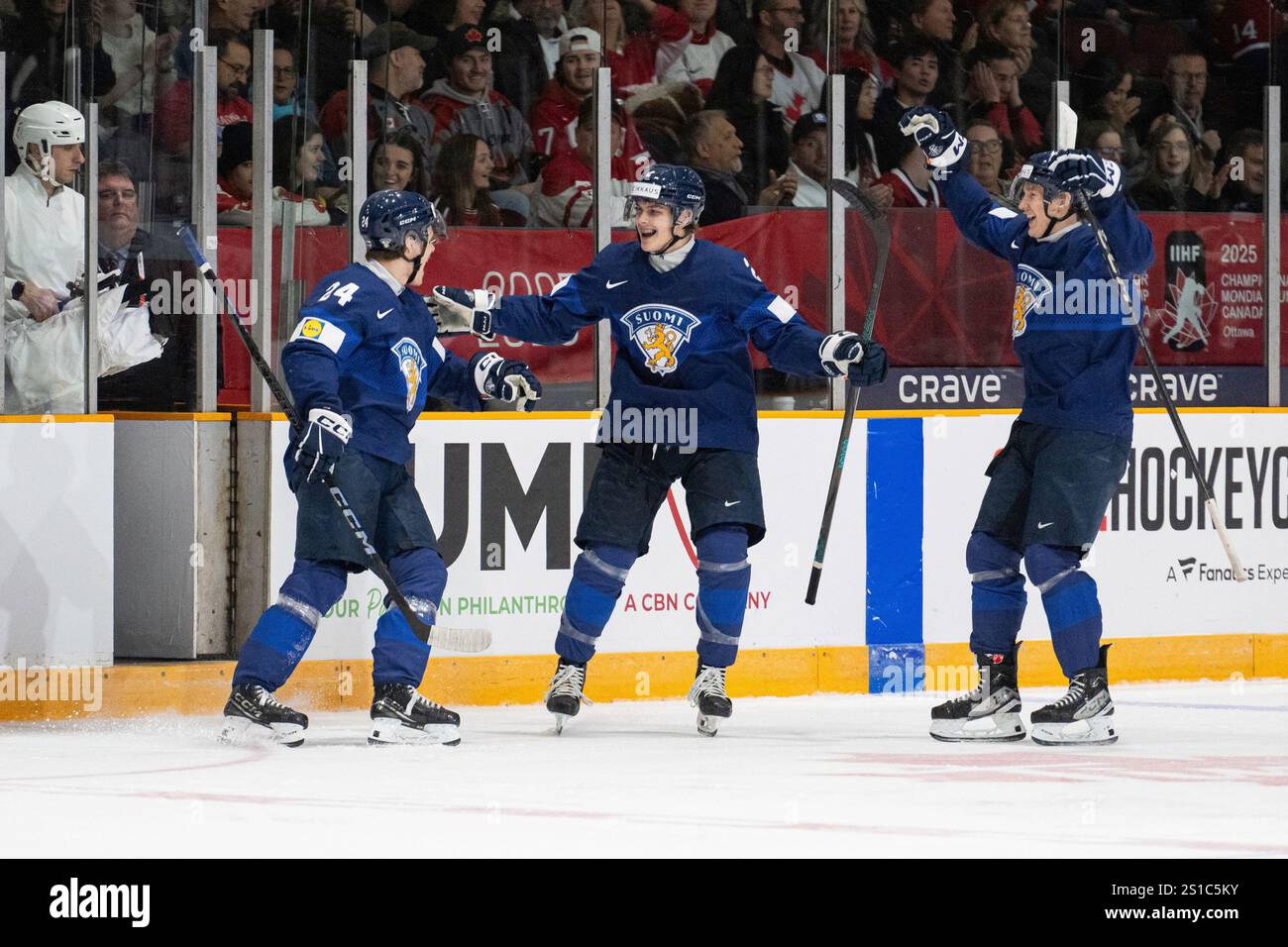 Finland forward Jesse Nurmi (24) celebrates his goal with teammates ...