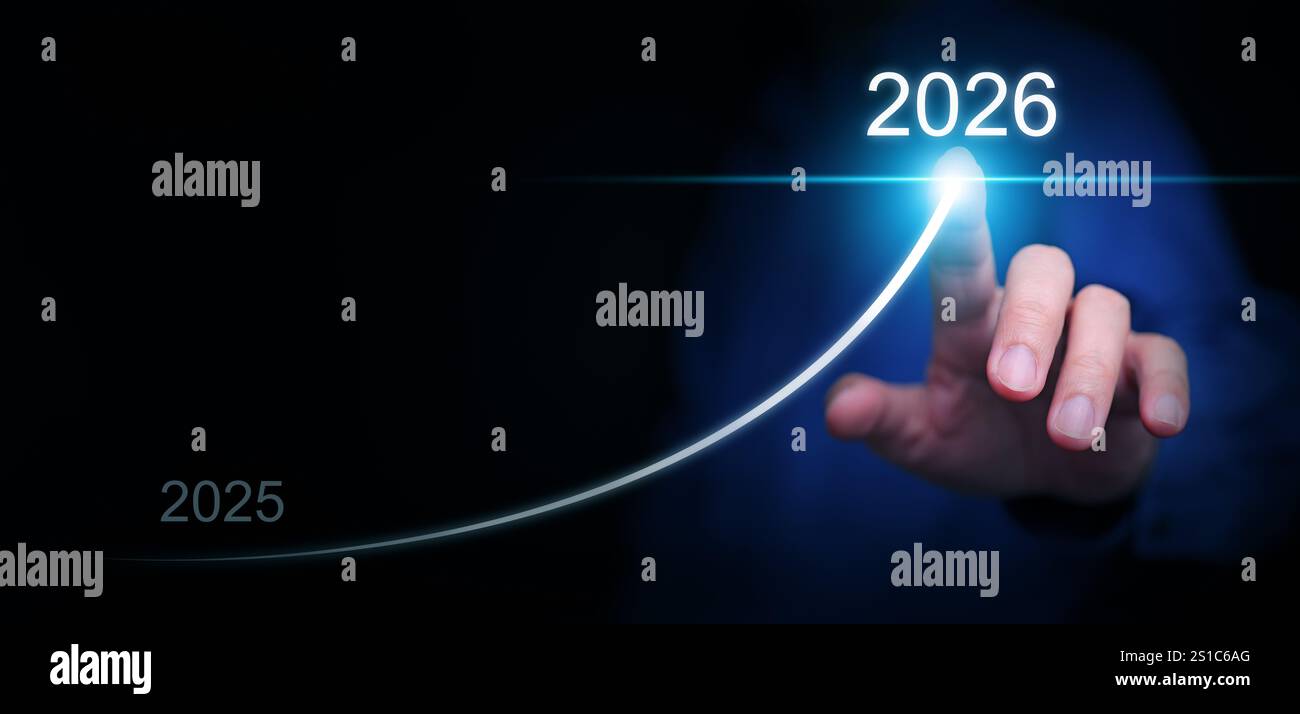 Happy new year. A businessman draws a line rising up, from 2025 to 2026 ...