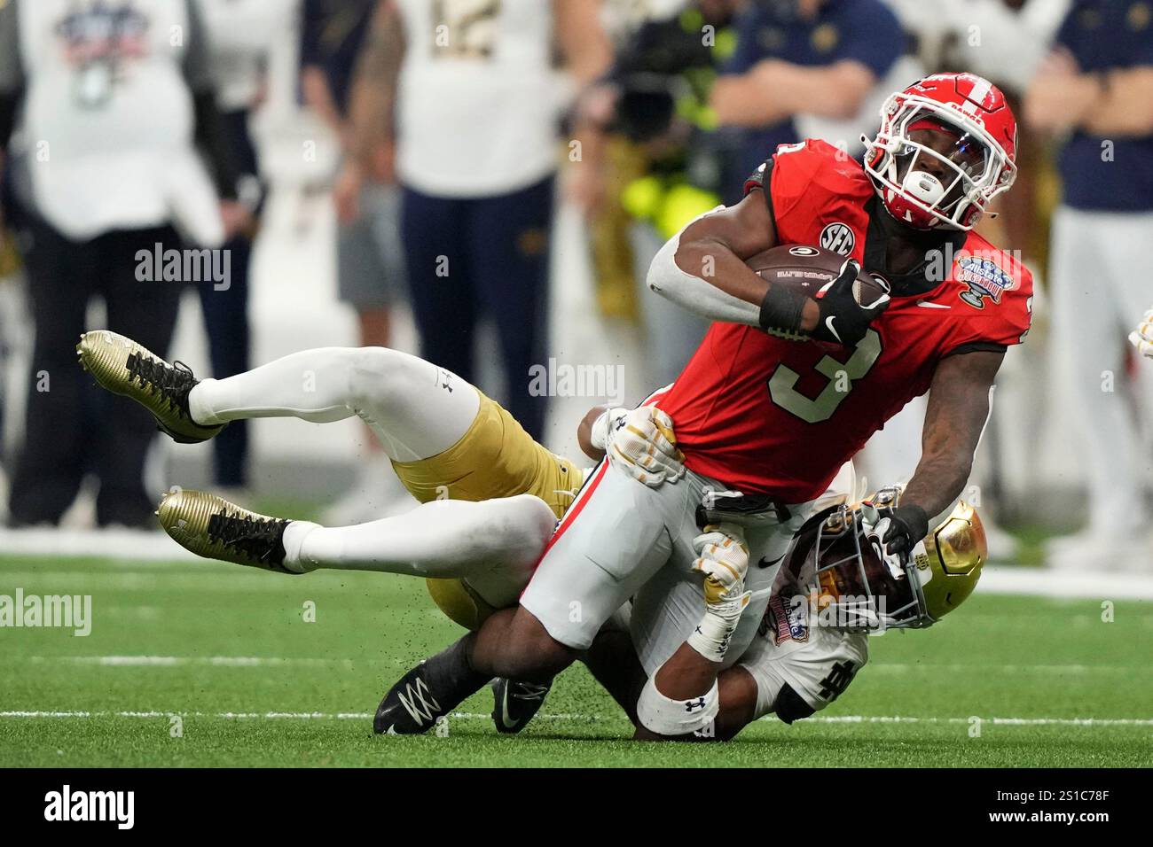 Georgia running back Nate Frazier (3) is tackled by Notre Dame safety ...