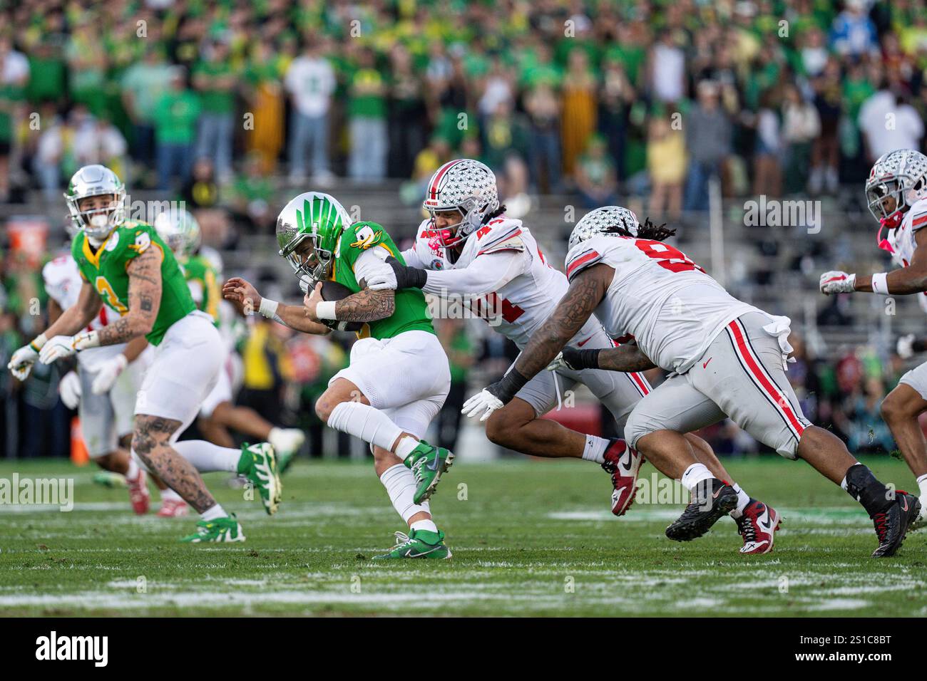 Ohio State Buckeyes defensive end JT Tuimoloau (44) tackles Oregon Ducks quarterback Dillon ...