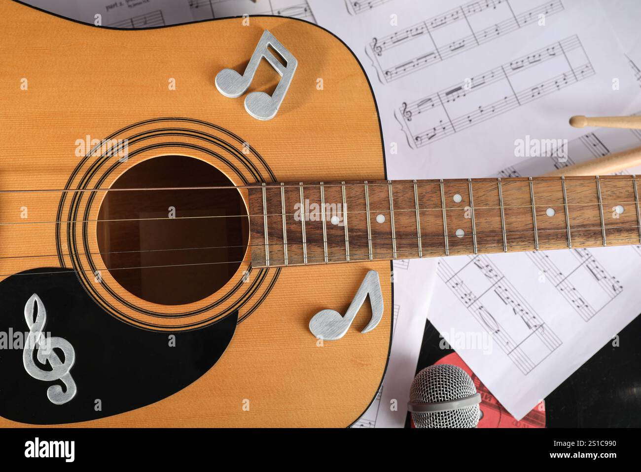 Guitar with note signs and music sheets, closeup Stock Photo - Alamy