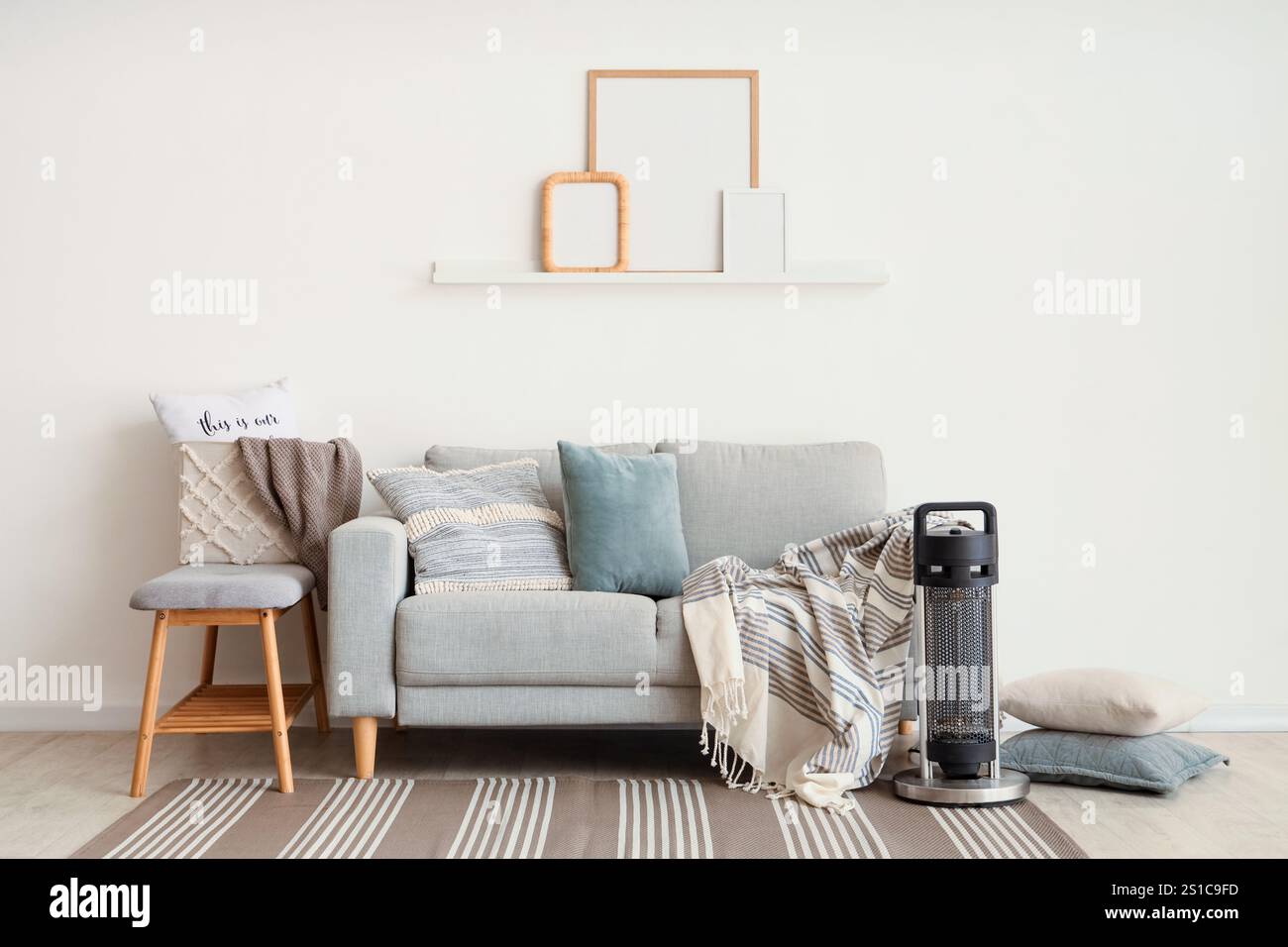 Interior of living room with sofa, soft bench and electric heater Stock ...