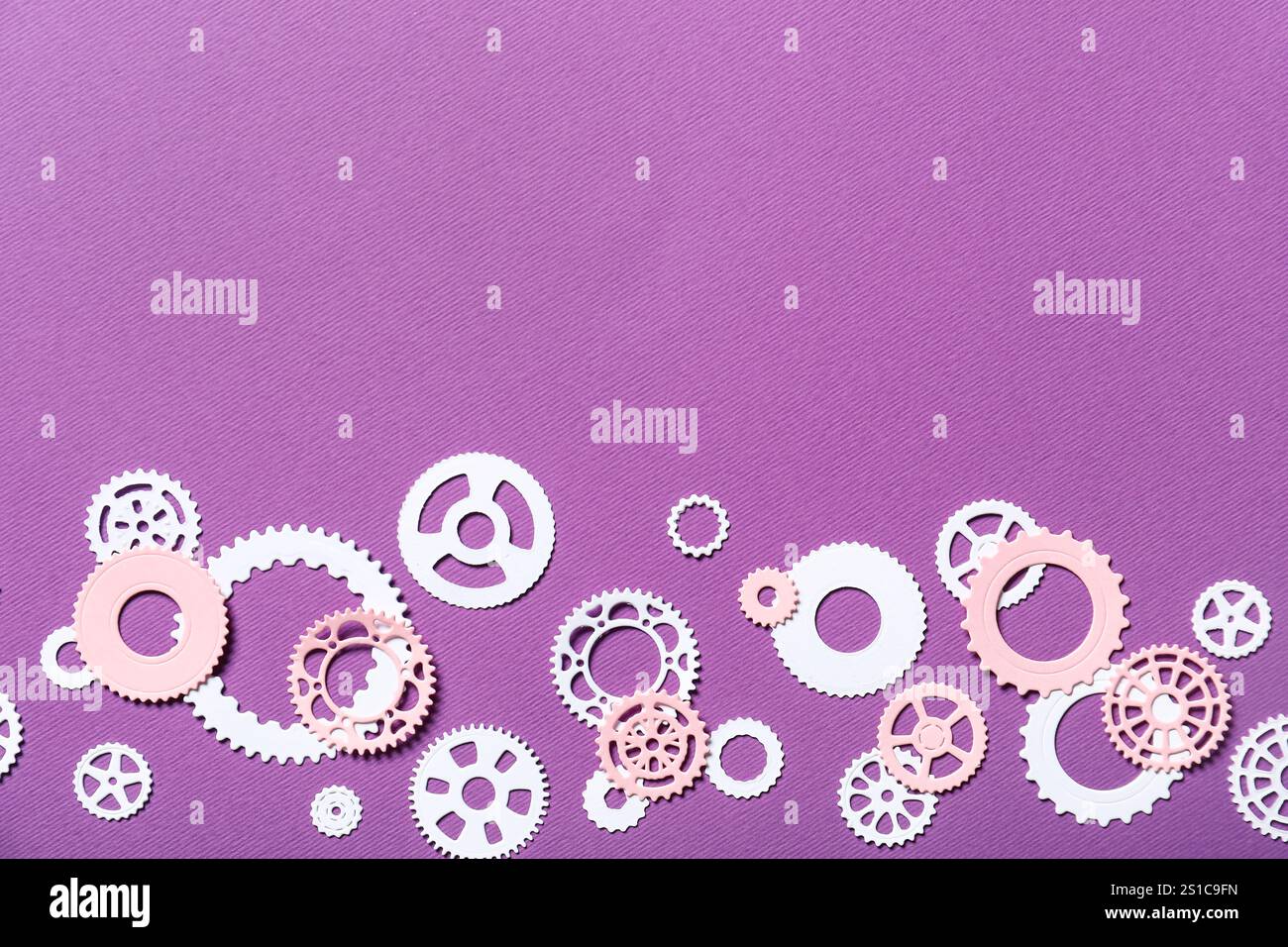 Different paper gears on purple background Stock Photo - Alamy