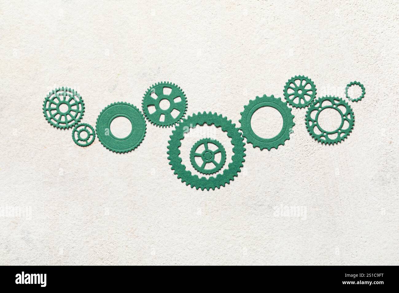 Green paper gears on white background Stock Photo - Alamy