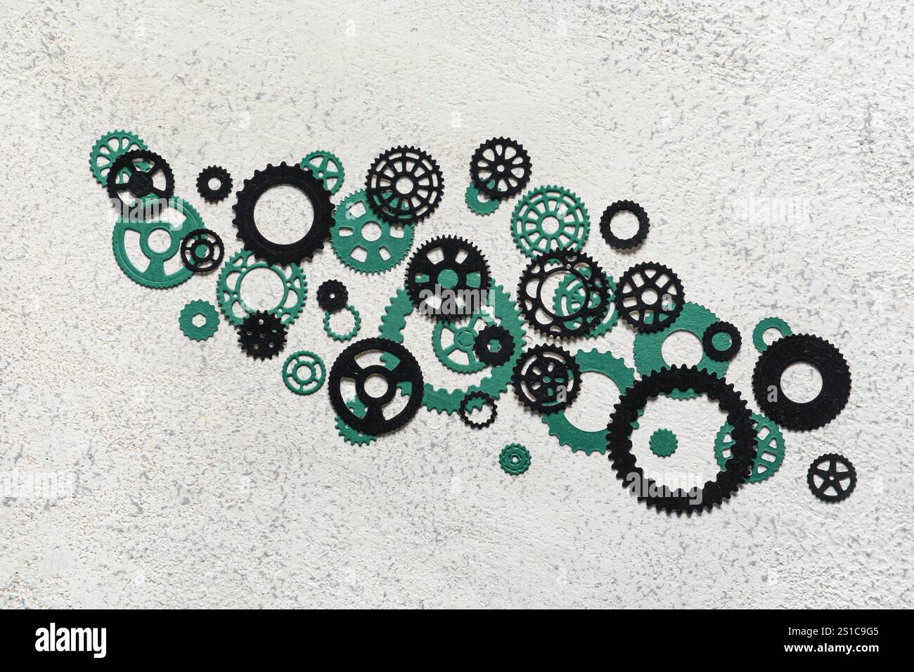 Different paper gears on white background Stock Photo - Alamy