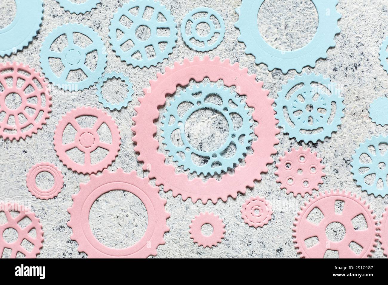 Different paper gears on white background Stock Photo - Alamy