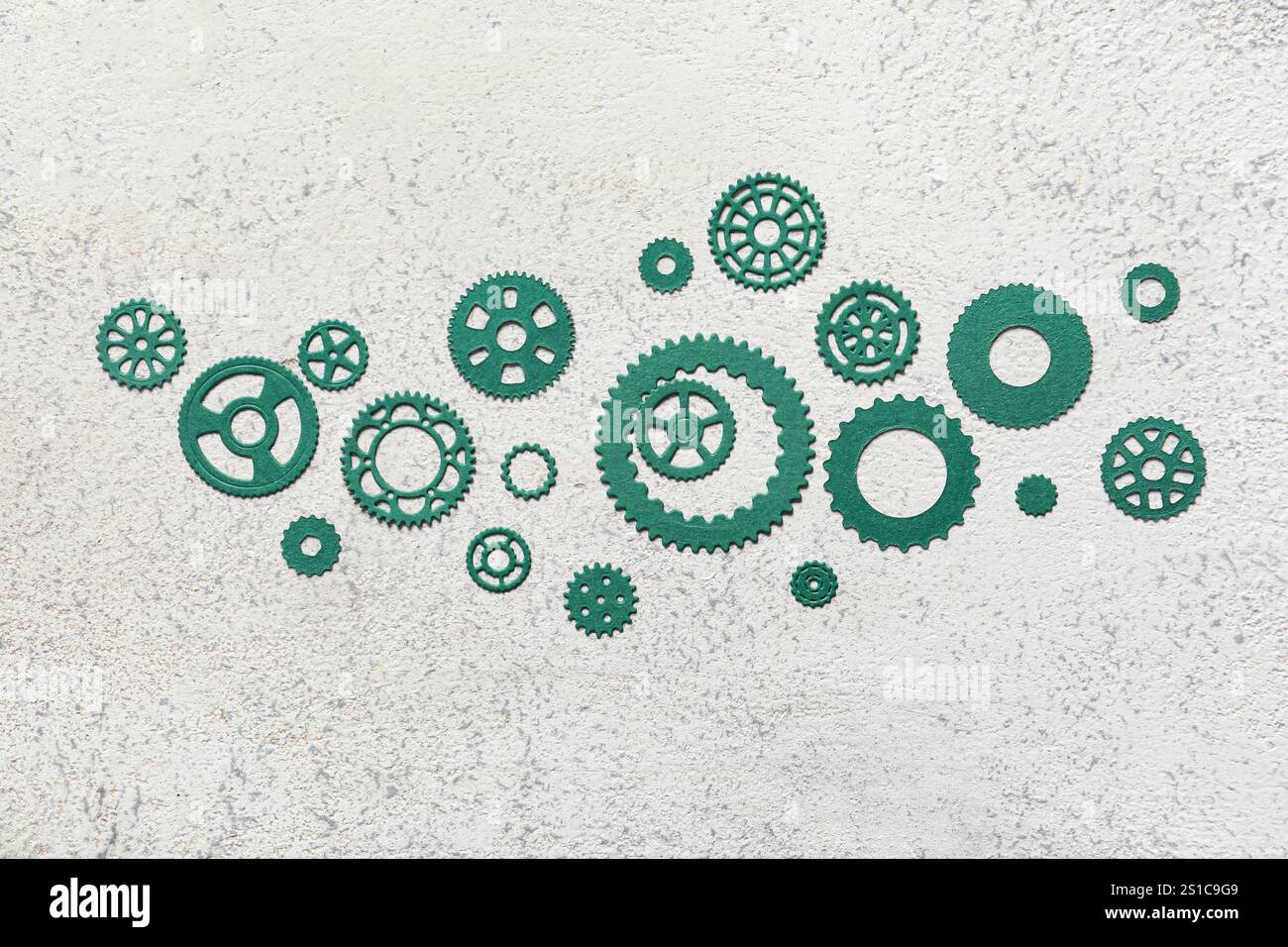 Green paper gears on white background Stock Photo - Alamy