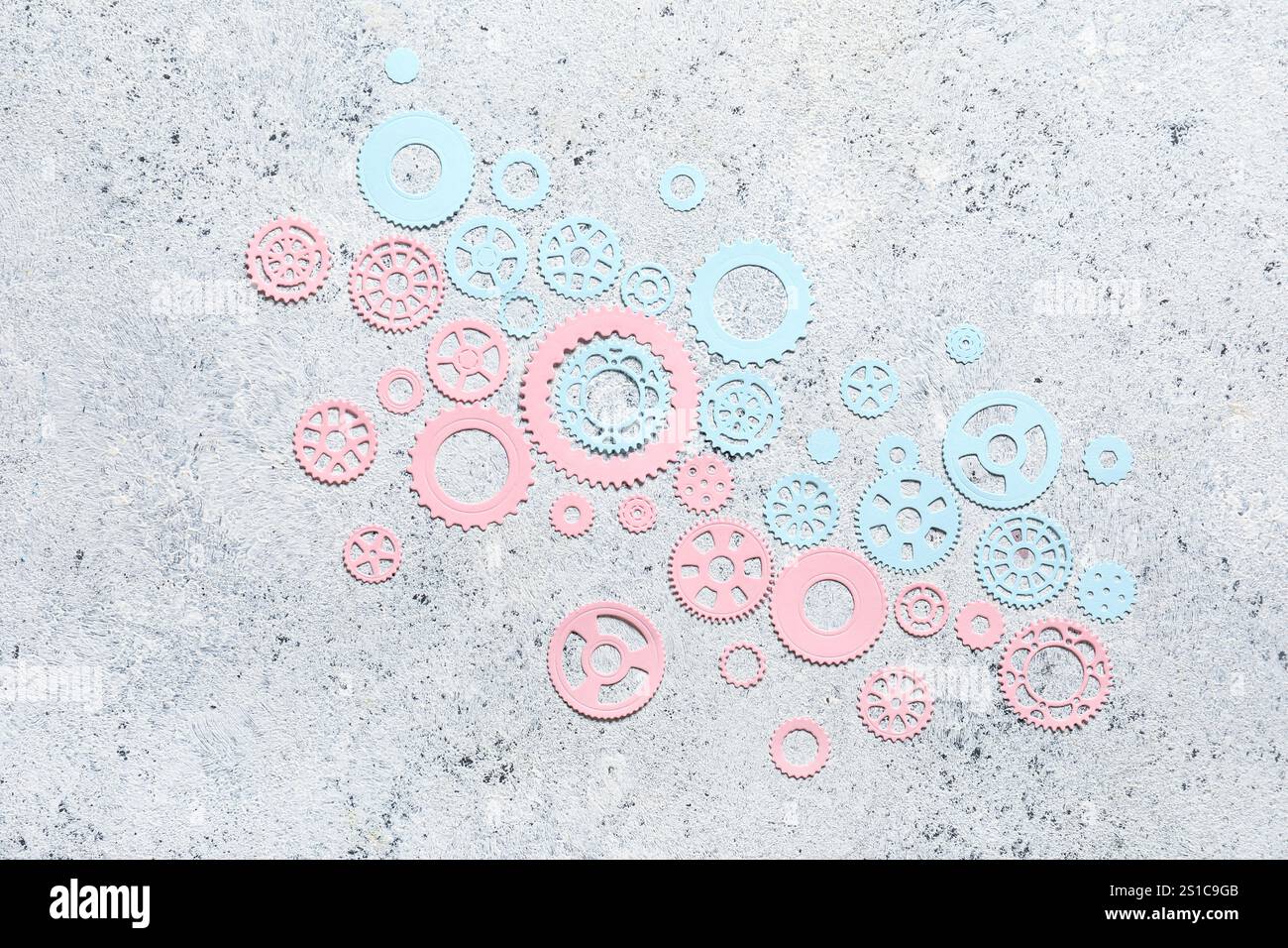 Different paper gears on white background Stock Photo - Alamy