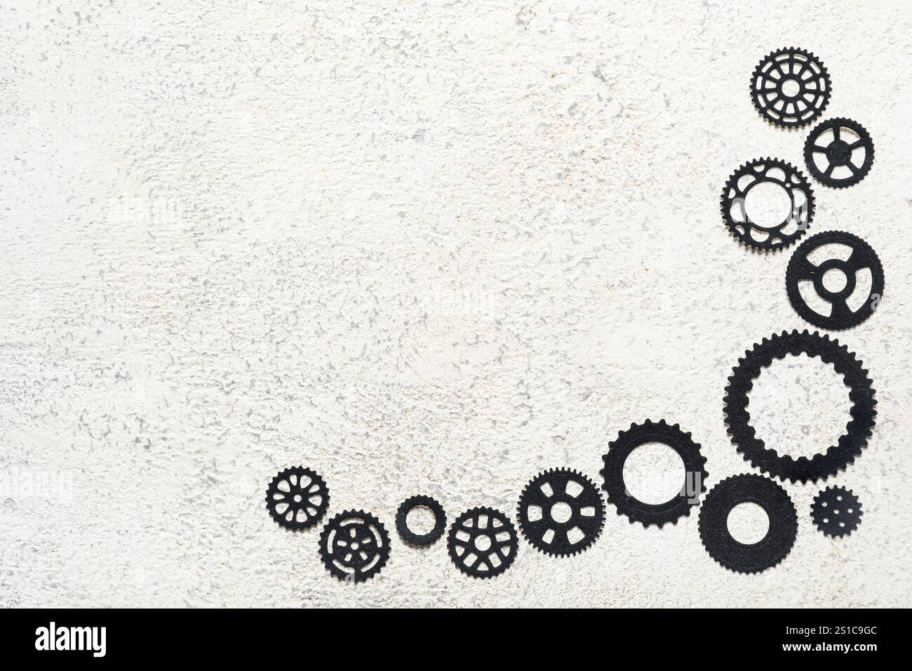 Black paper gears on white background Stock Photo - Alamy
