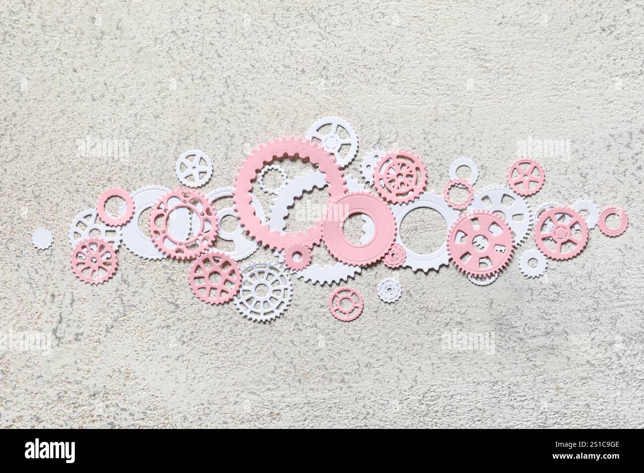 Different paper gears on white background Stock Photo - Alamy