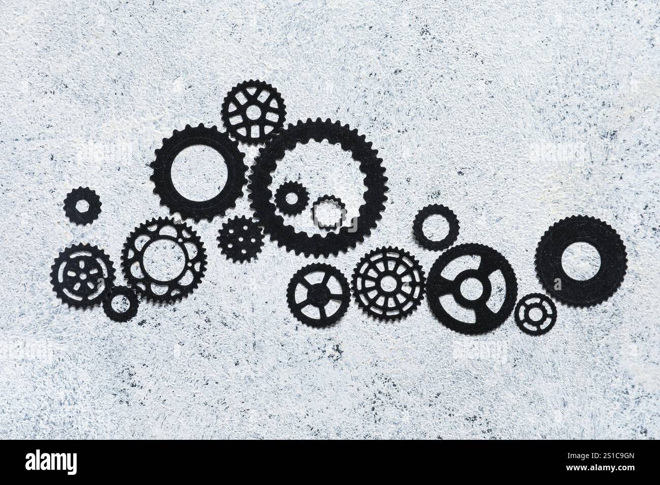 Black paper gears on white background Stock Photo - Alamy