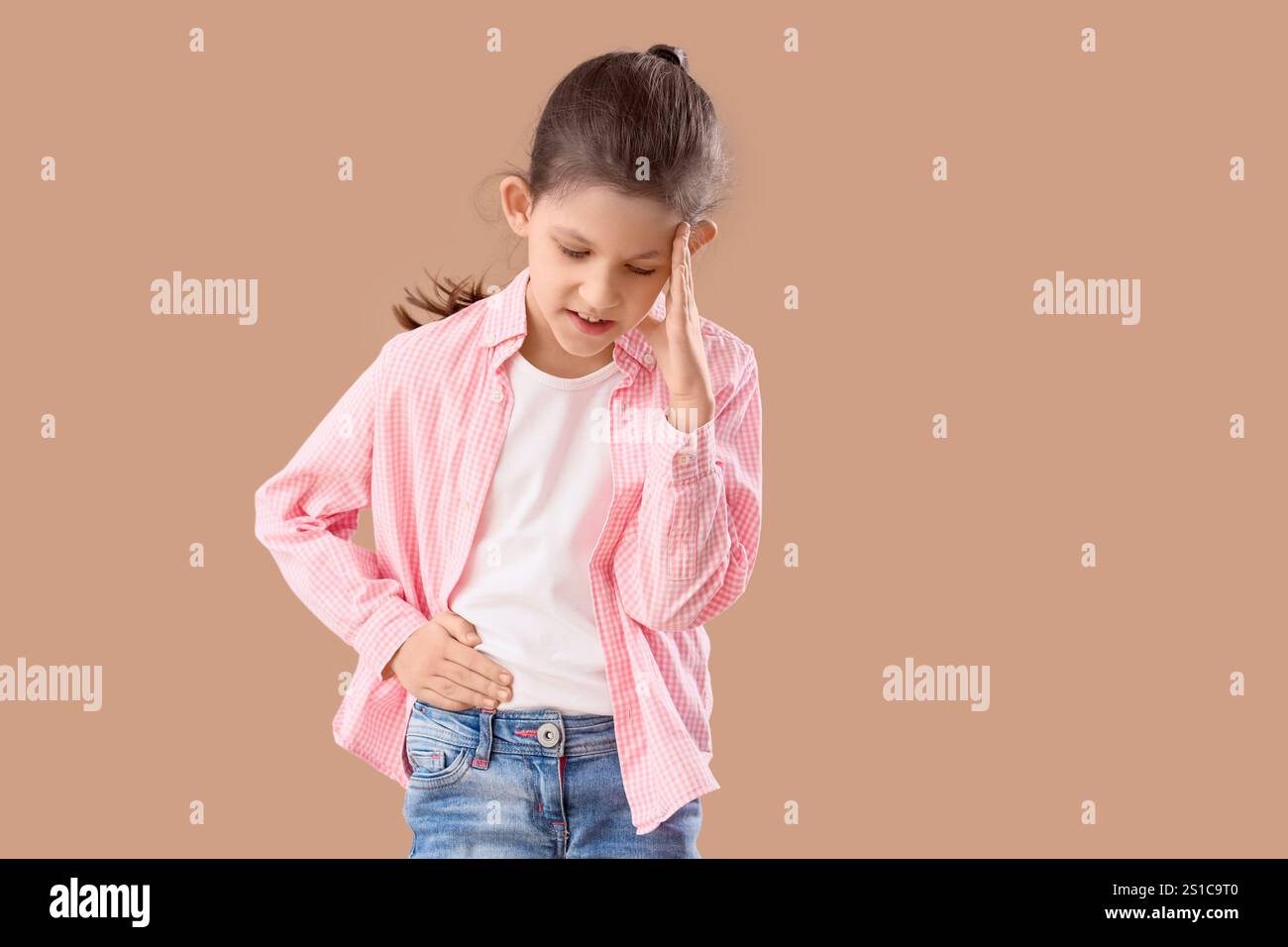 Teenage girl with appendicitis on beige background Stock Photo - Alamy