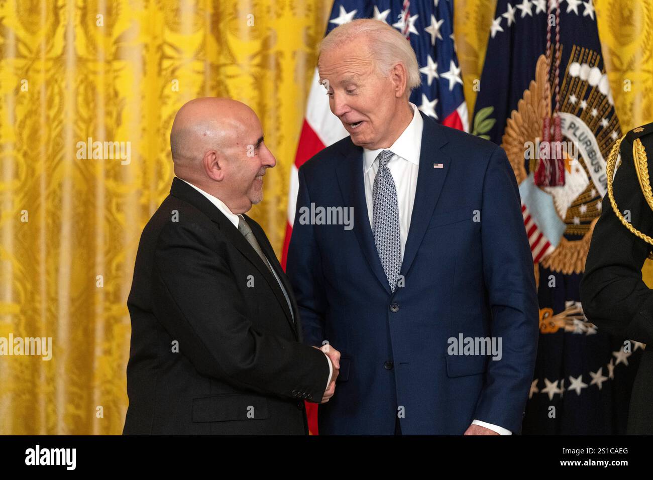 President Joe Biden awards the Presidential Citizens Medal to Evan ...