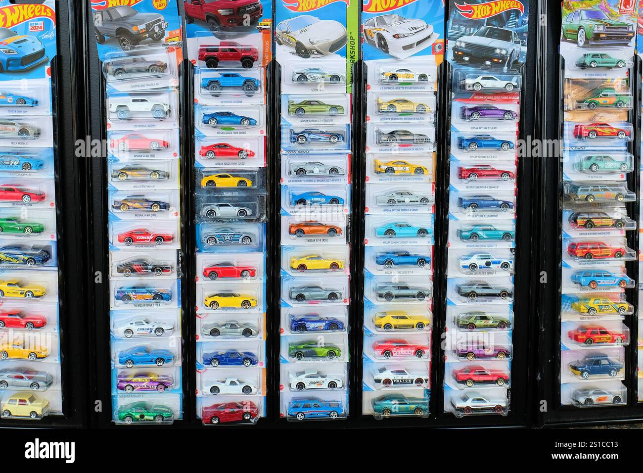Packs of Hot Wheels die cast scale model toy cars in rows and in ...