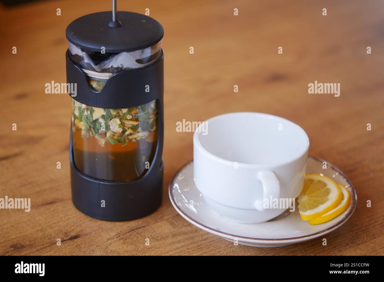 Preparation of Herbal Tea with Lemon Using a French Press Device Stock ...
