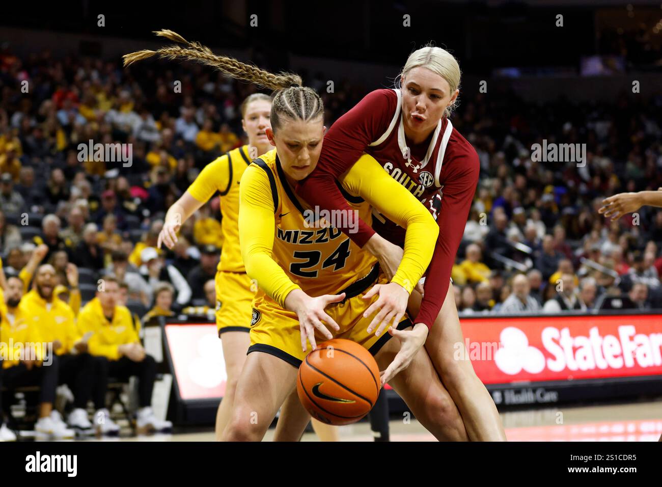 South Carolina forward Chloe Kitts, back, fouls Missouri guard Ashton ...