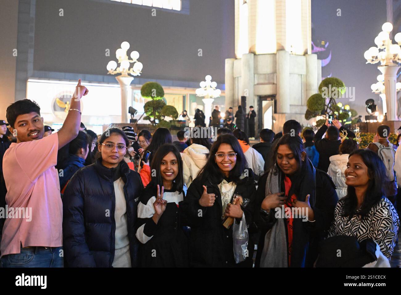 Chongqing,China.1st January 2025. People pose at Jiefangbei Pedestrian ...
