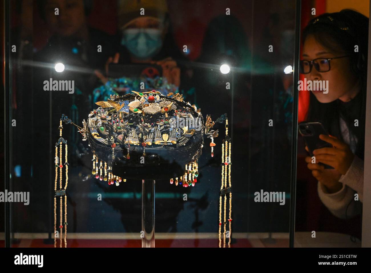 A phoenix crown with kingfisher feather art attracts visitors ...