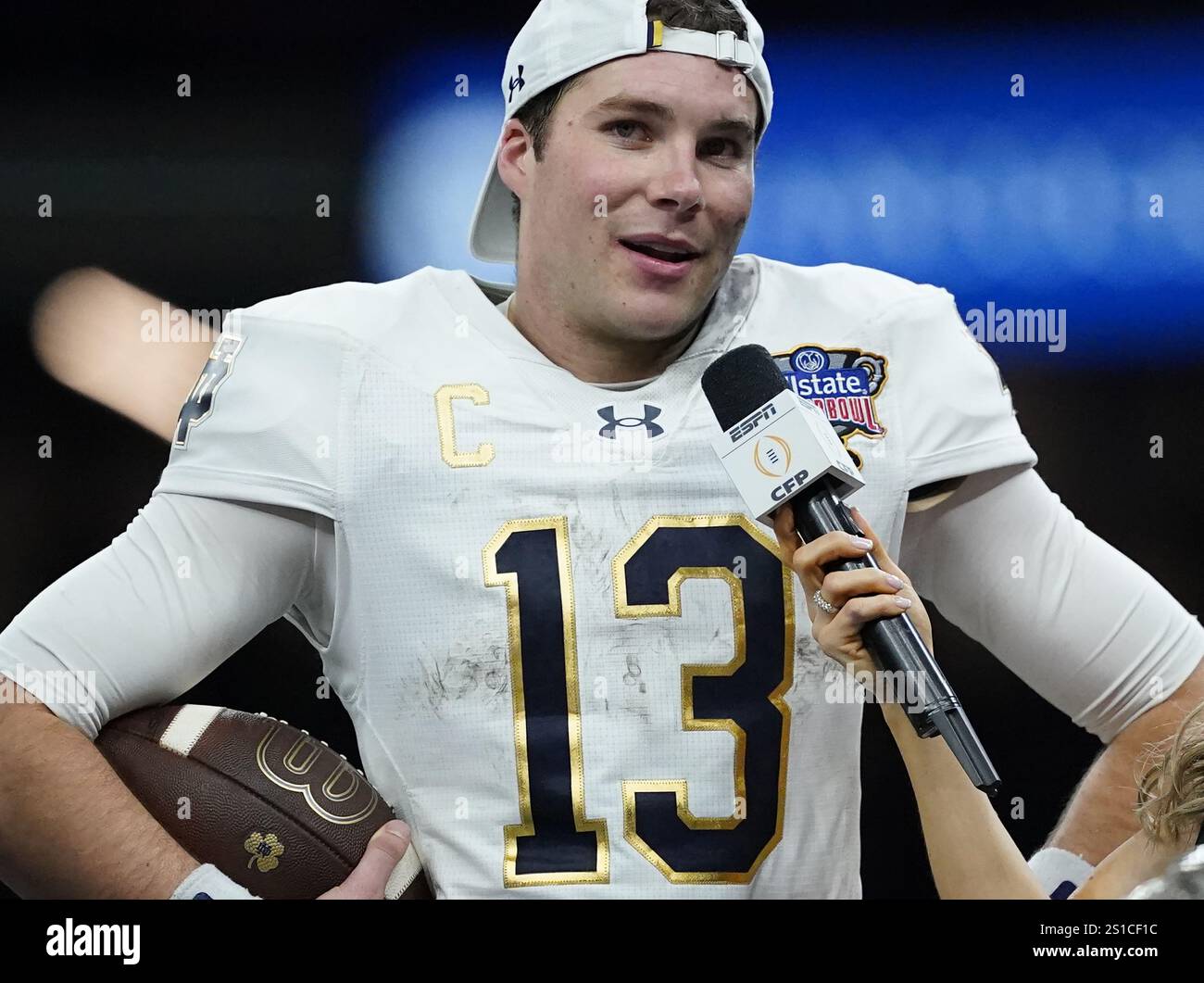 Notre Dame quarterback Riley Leonard is interviewed during a trophy ...