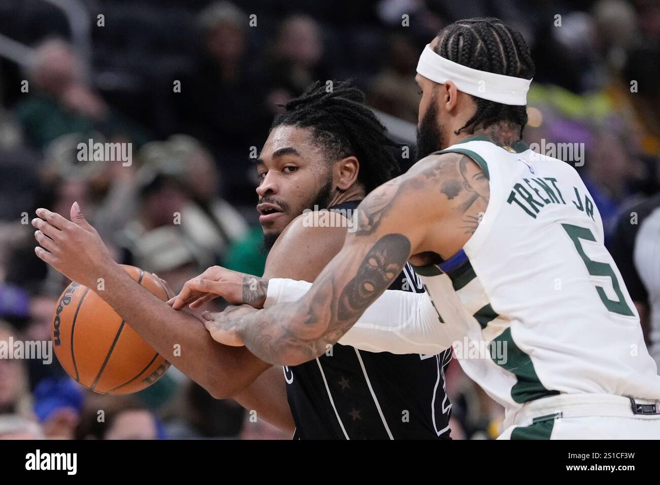 Brooklyn Nets' Cam Thomas tries to get past Milwaukee Bucks' Gary Trent ...