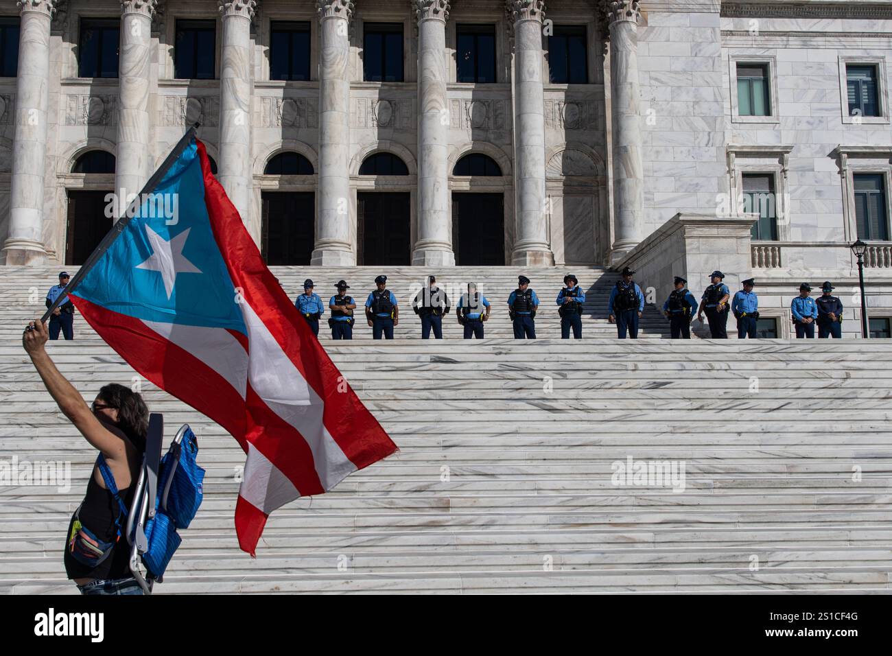 San Juan, USA. 02nd Jan, 2025. A man waves the Puerto Rican flag in ...