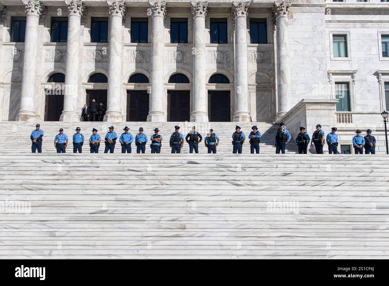 Police stand guard at the back entrance of the Puerto Rican Capitol ...
