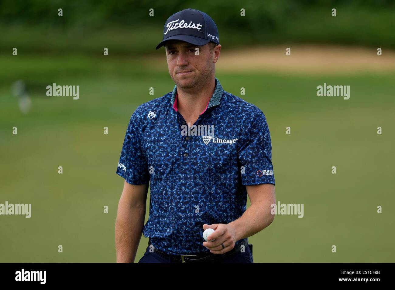 Justin Thomas walks off the 12th green during the first round of The ...