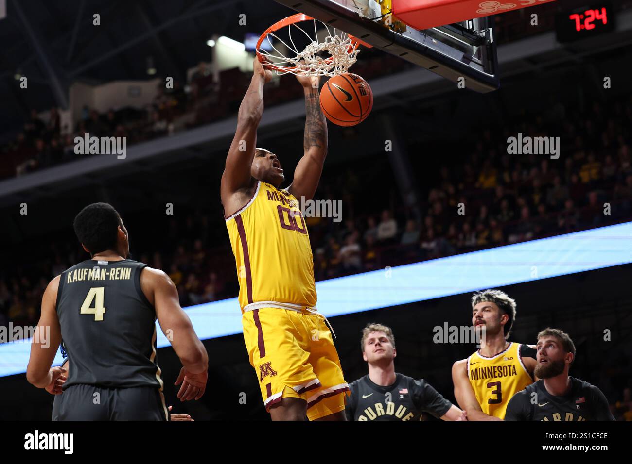 Minnesota forward Frank Mitchell (00) dunks over Purdue forward Trey ...