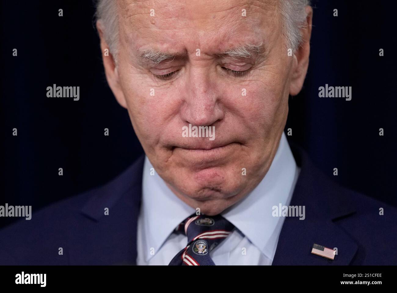 President Joe Biden pauses as he speaks about the death of former ...