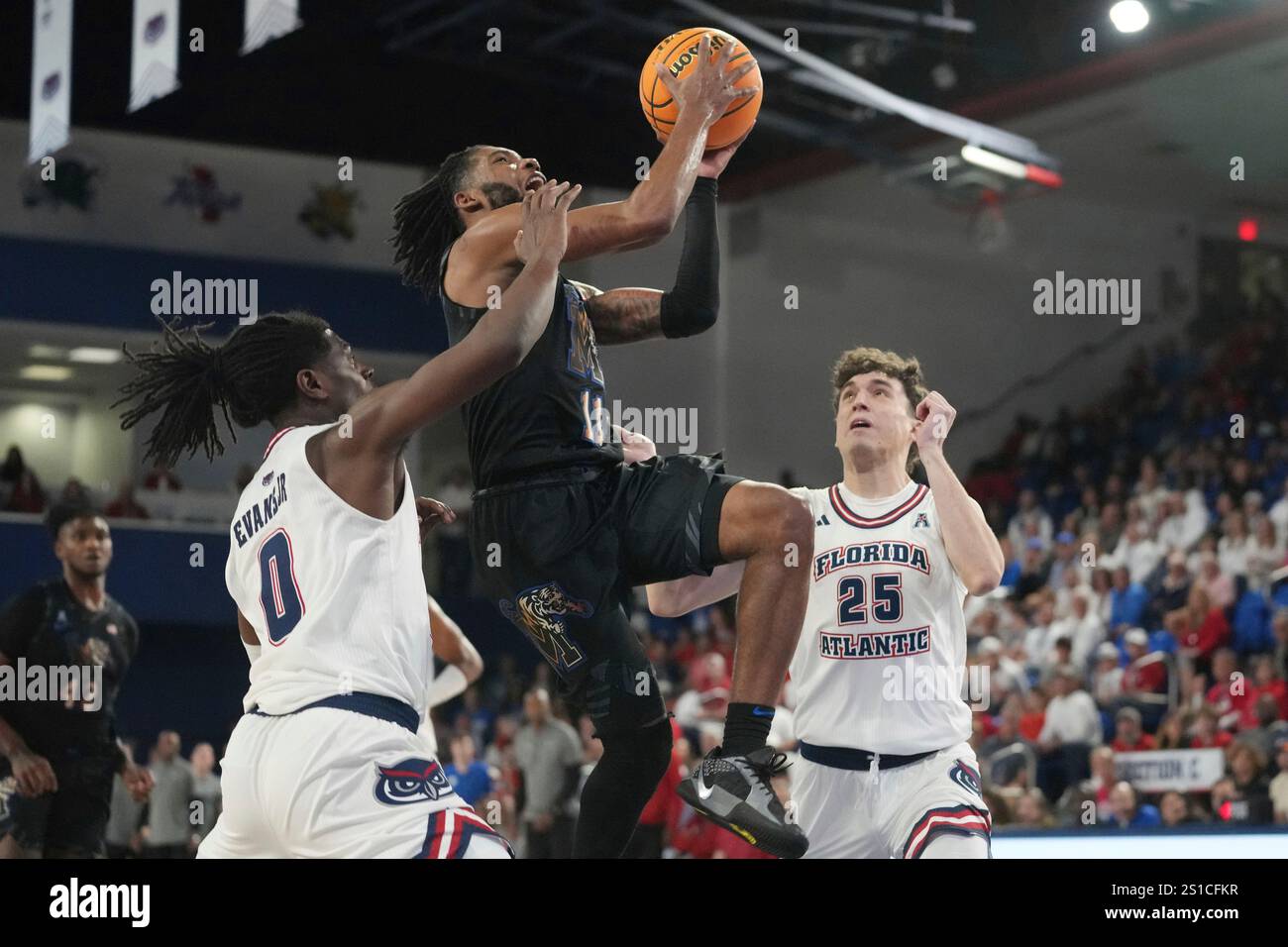 Memphis guard Tyrese Hunter (11) drives to the basket over Florida ...