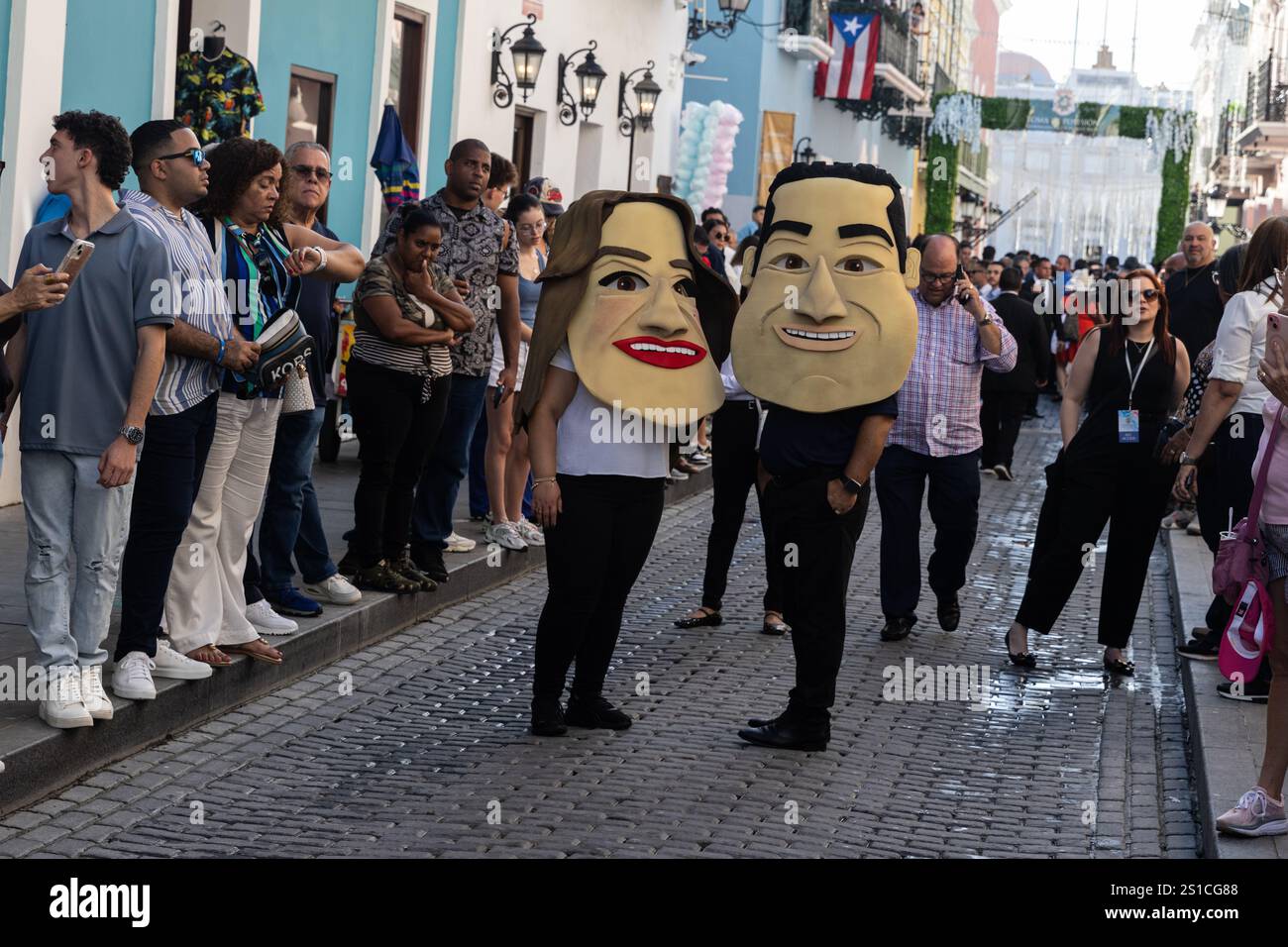 Two people wear costumes depicting Governor Jenniffer González Colón ...