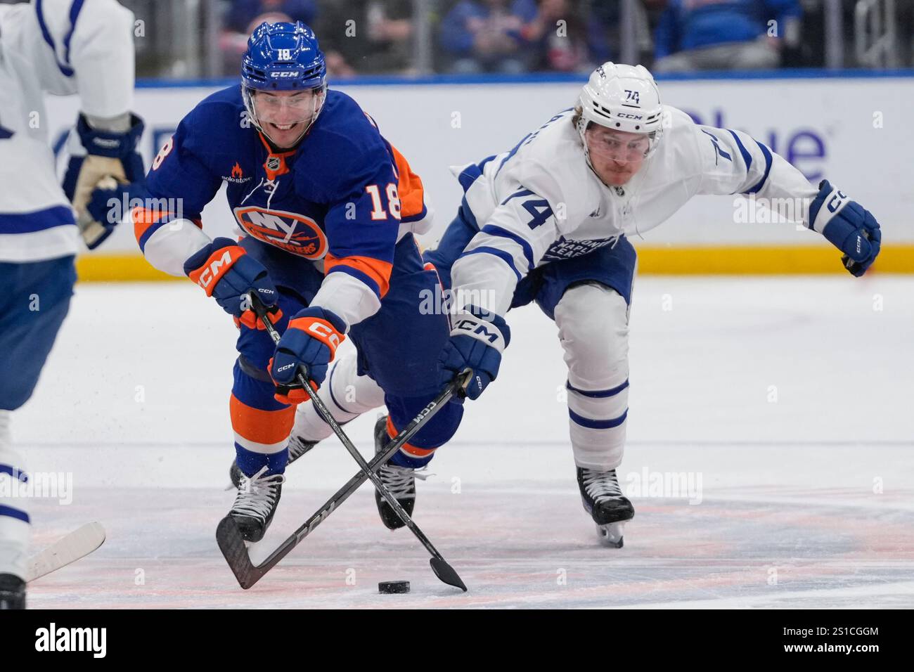 Toronto Maple Leafs' Bobby McMann (74) fights for control of the puck ...