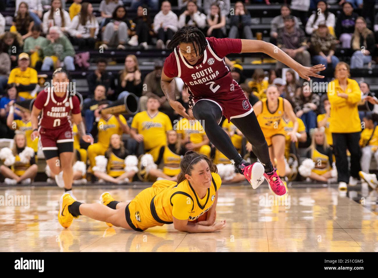 South Carolina's Ashlyn Watkins, top, leaps over Missouri's Hannah ...