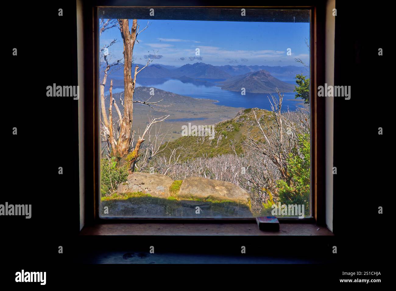 Lake and peaks seen through a window frame from inside emergency ...