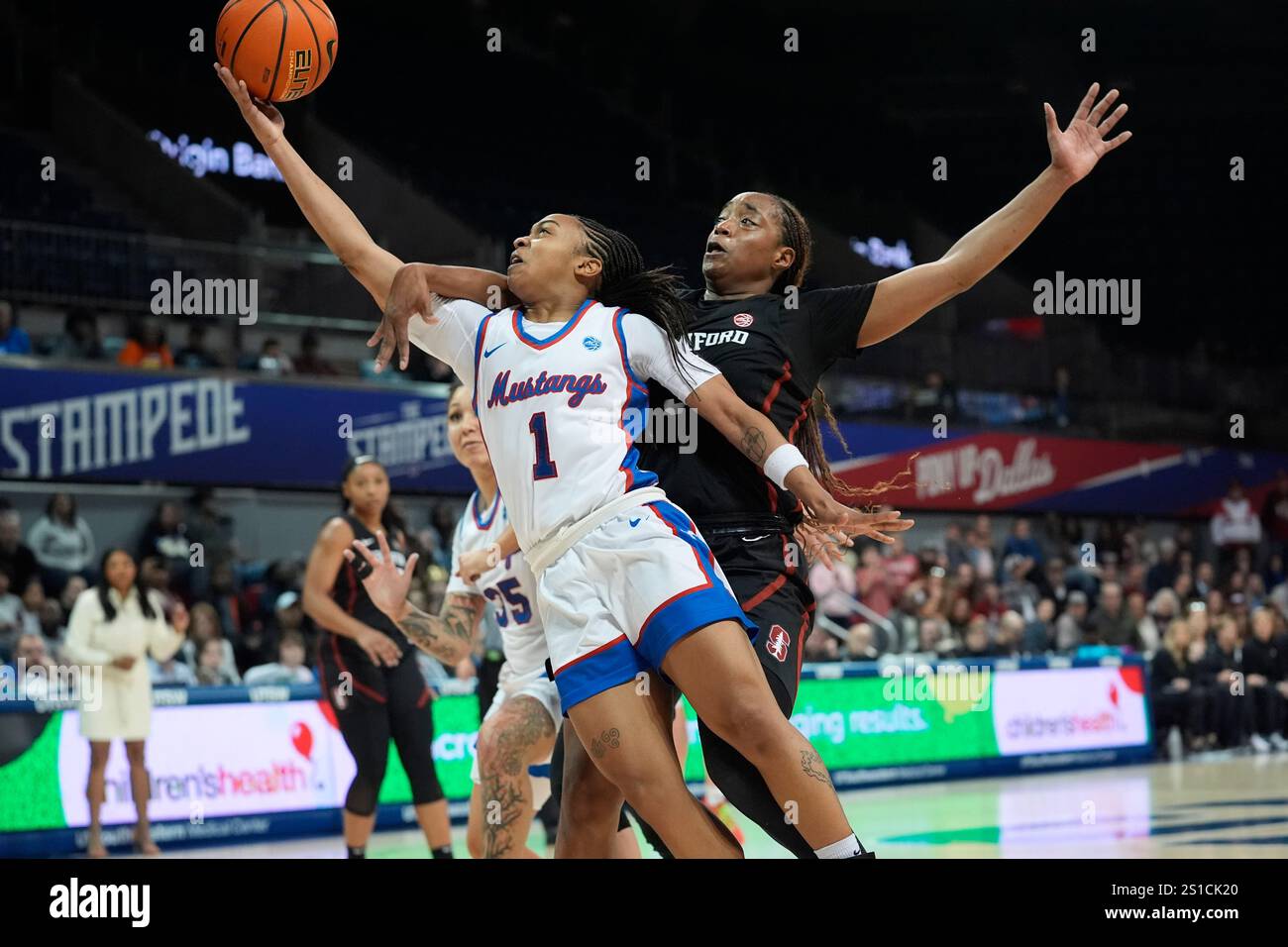 SMU guard Zanai Jones (1) is fouled by Stanford forward Nunu Agara (3) during the second half of ...