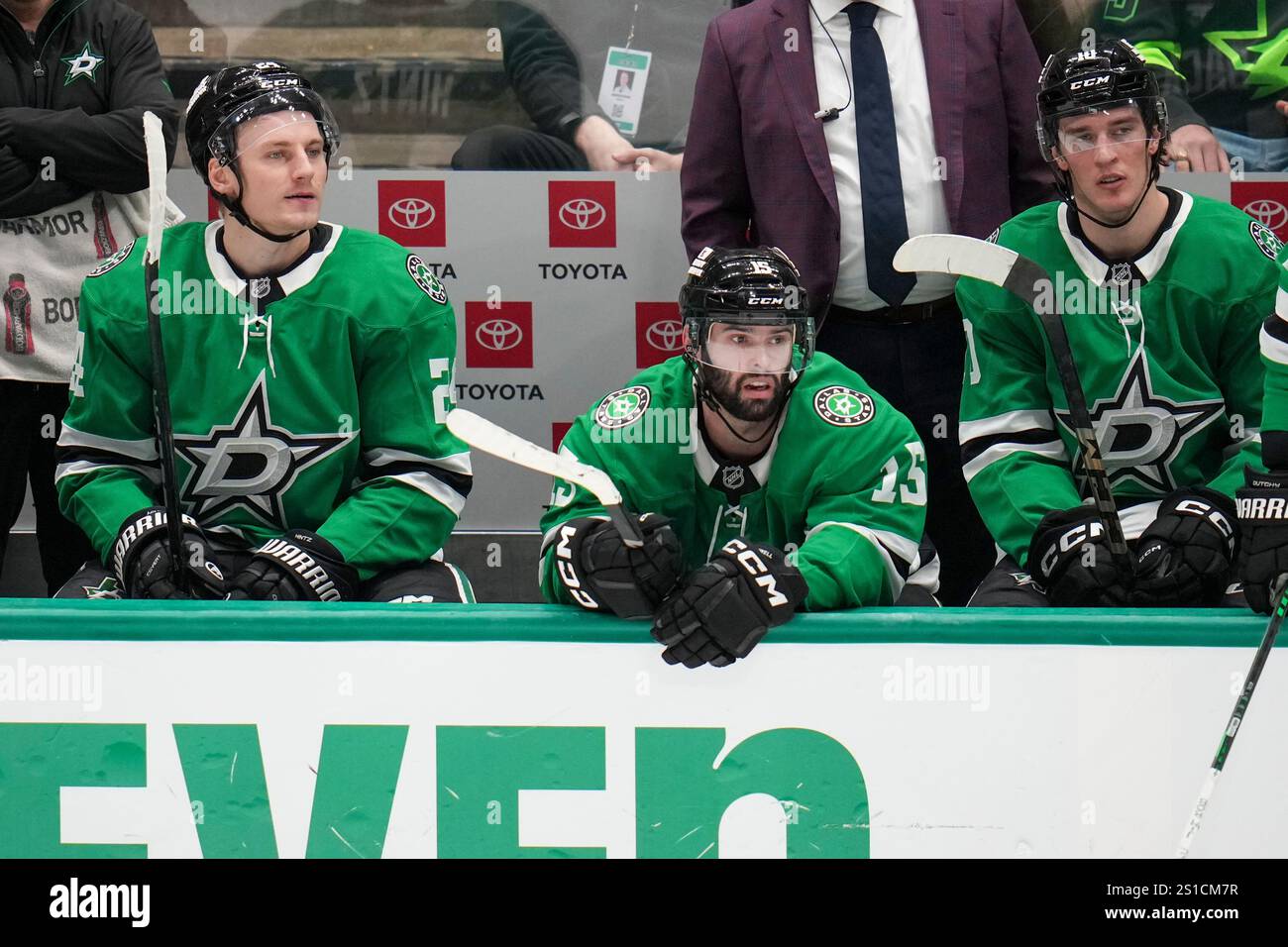 Dallas Stars center Roope Hintz, left, sits on the bench with teammates ...