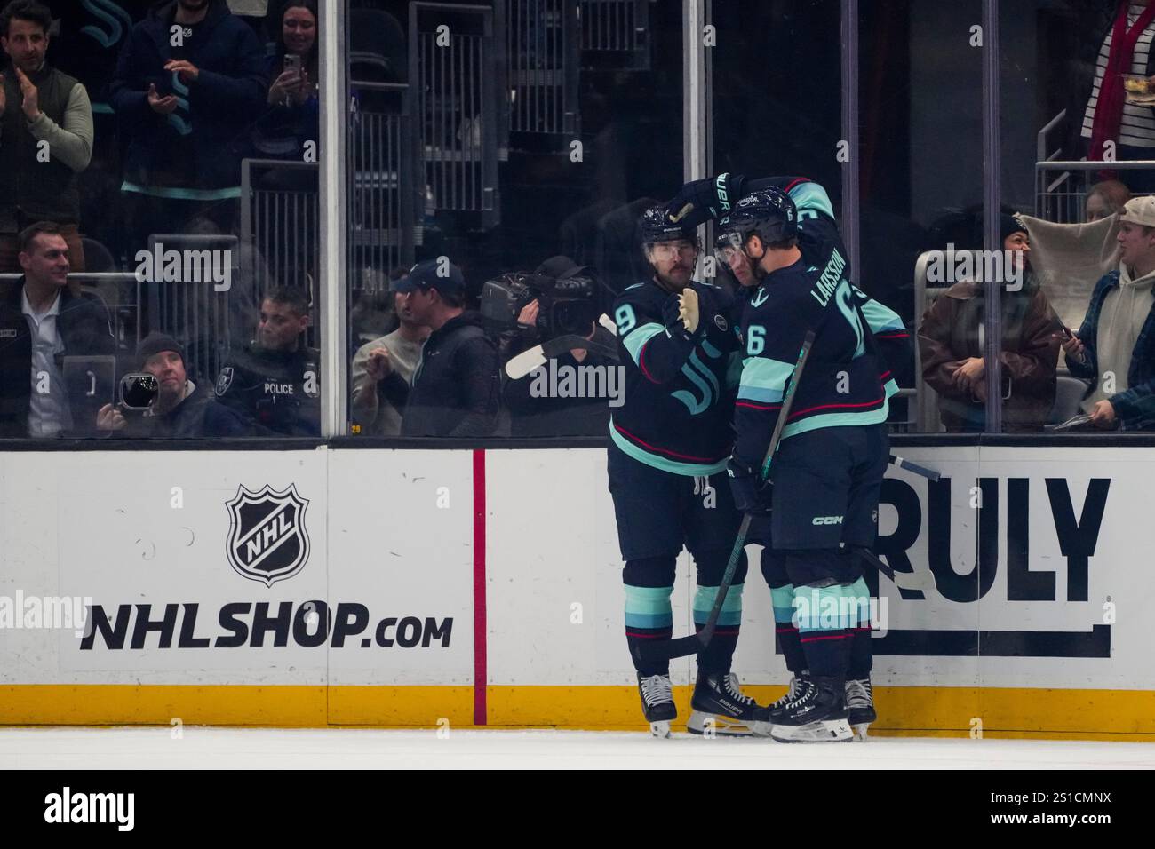 Seattle Kraken center Chandler Stephenson, left, celebrates his goal ...