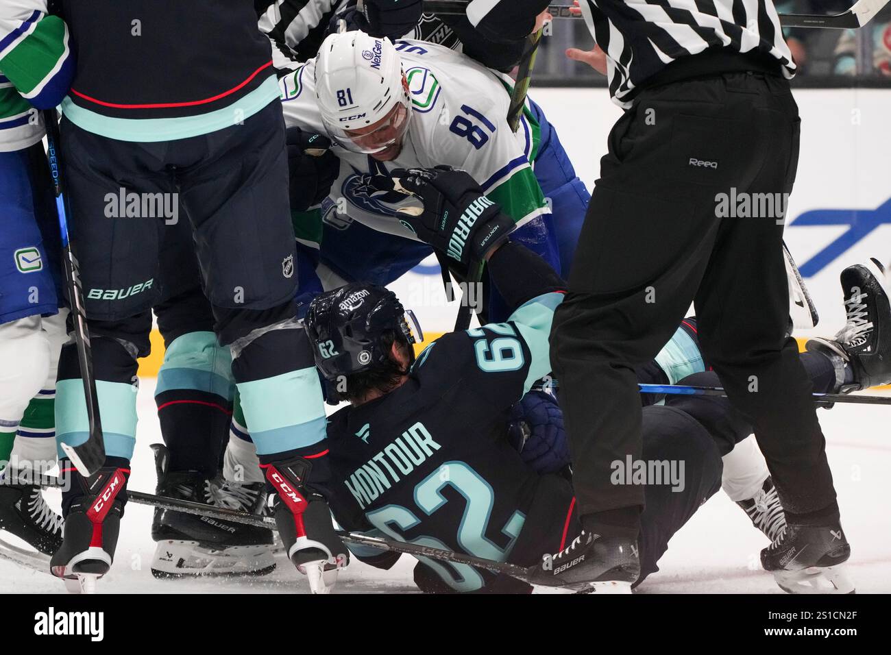 Vancouver Canucks center Dakota Joshua (81) fights with Seattle Kraken ...