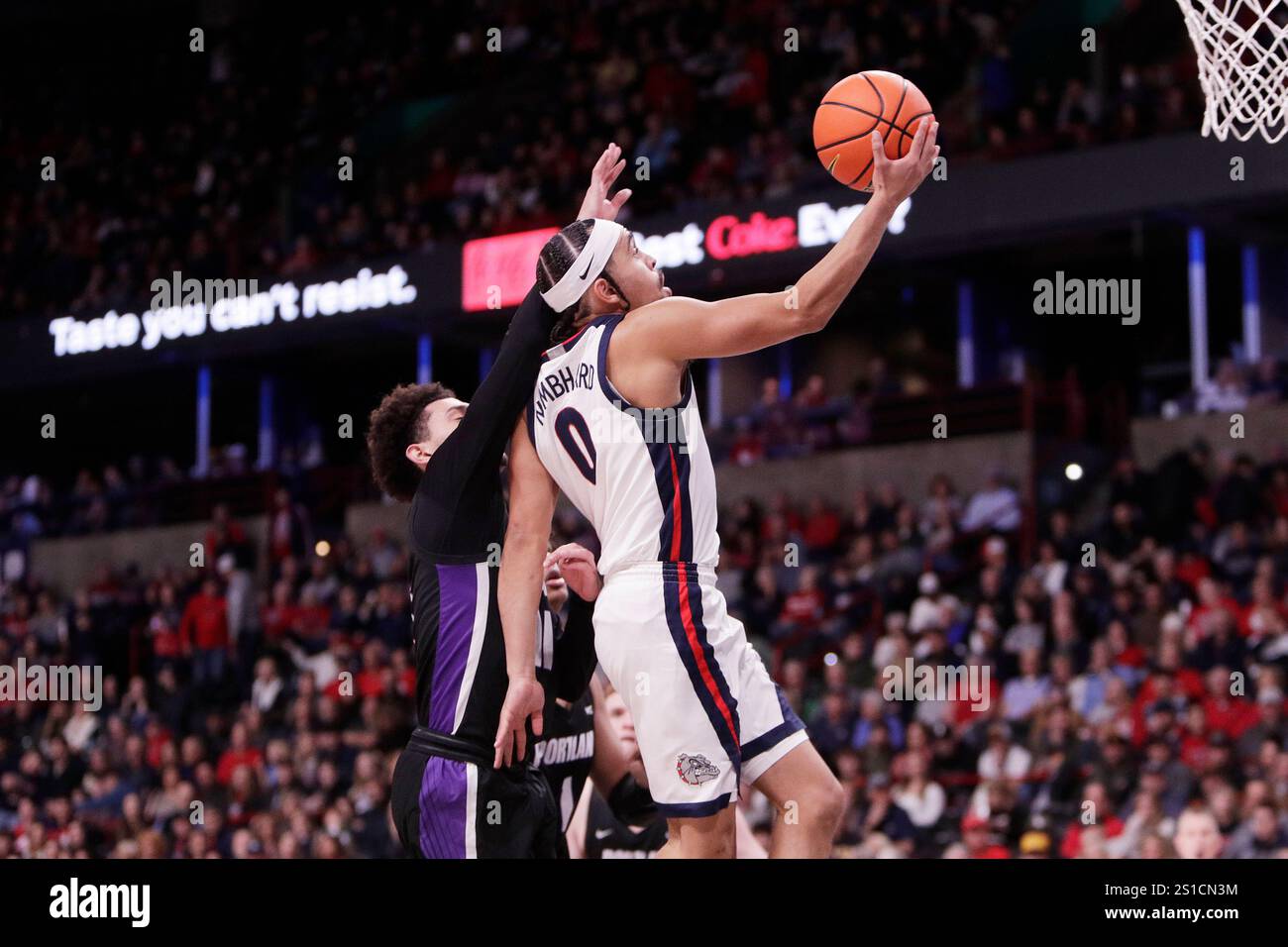 Gonzaga guard Ryan Nembhard, right, drives to the basket while ...