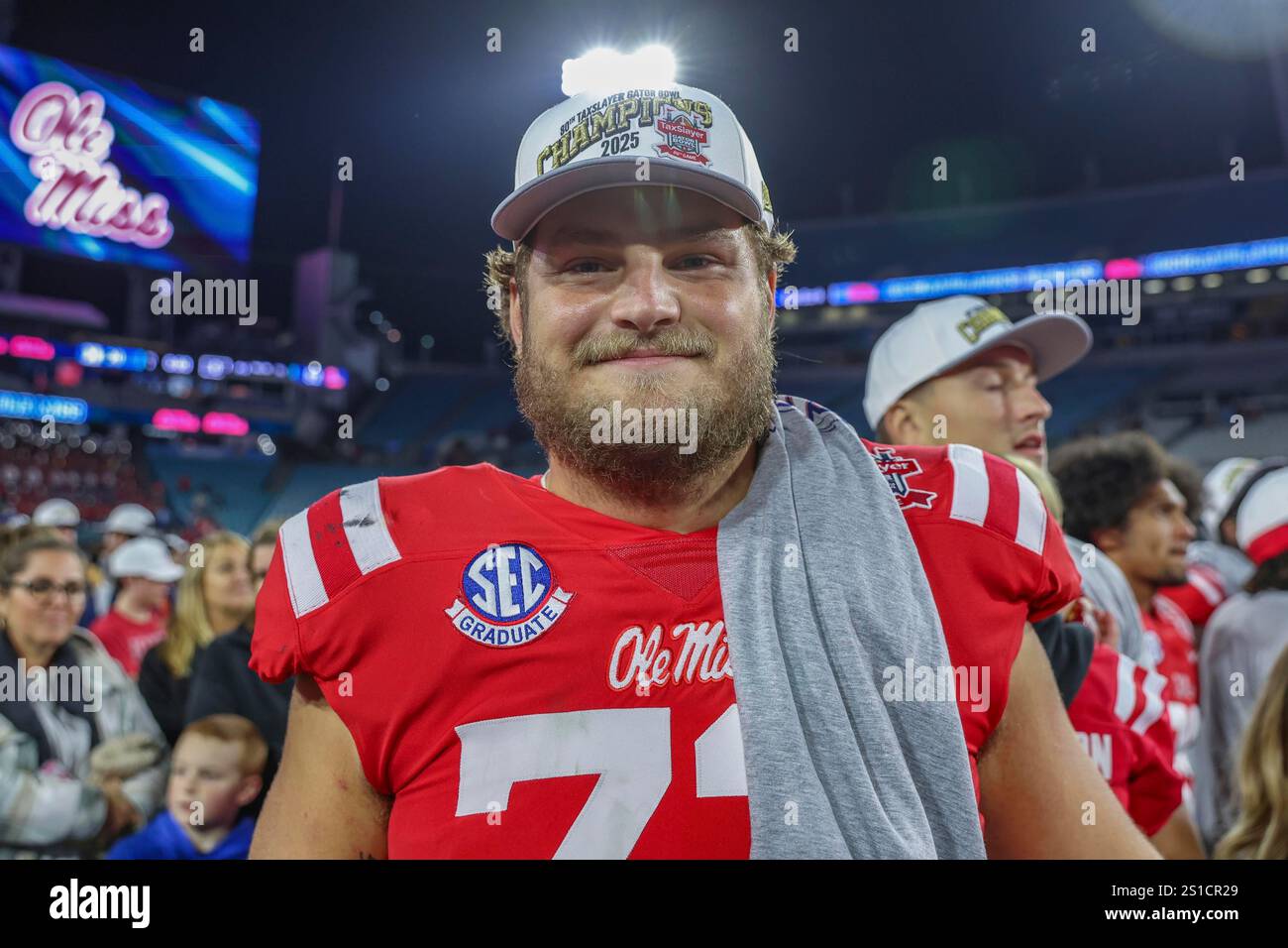 Mississippi offensive tackle Eli Acker poses after defeating Duke in ...