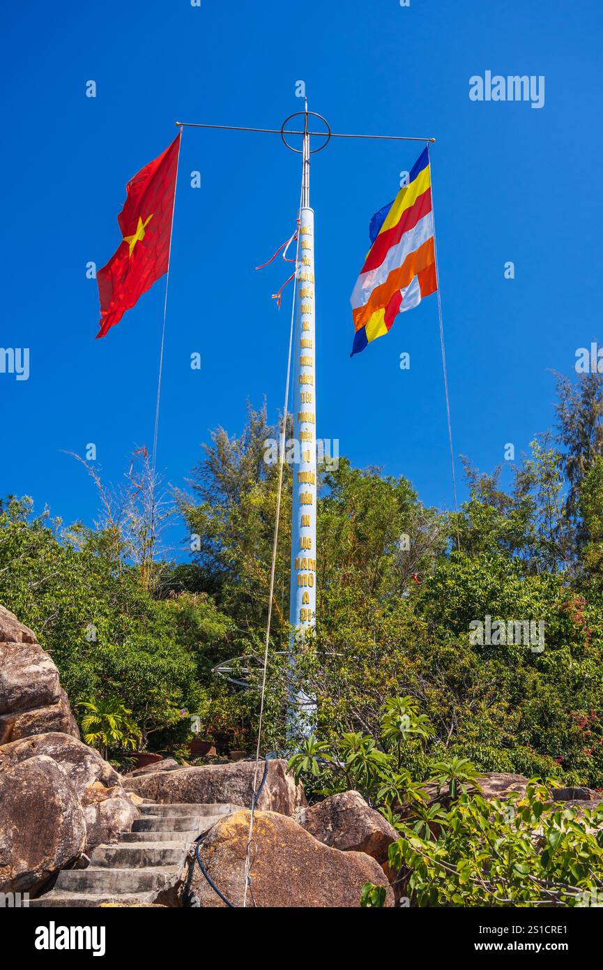 Flagpole with the flag of Vietnam on the island with the Tu ton pagoda ...